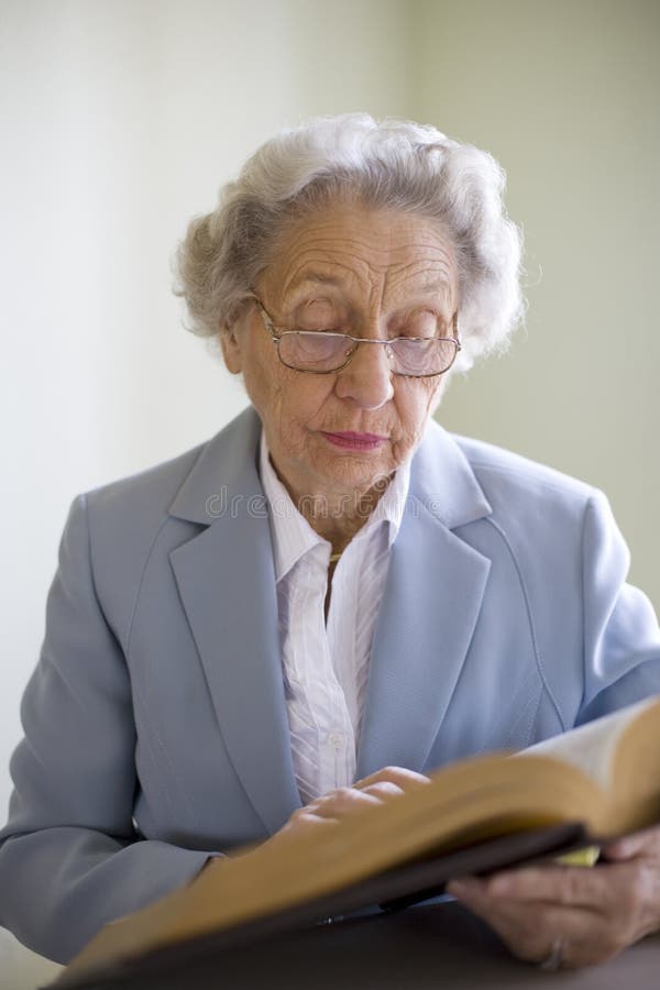 Senior woman reading Bible stock image. Image of grandmother - 4603687
