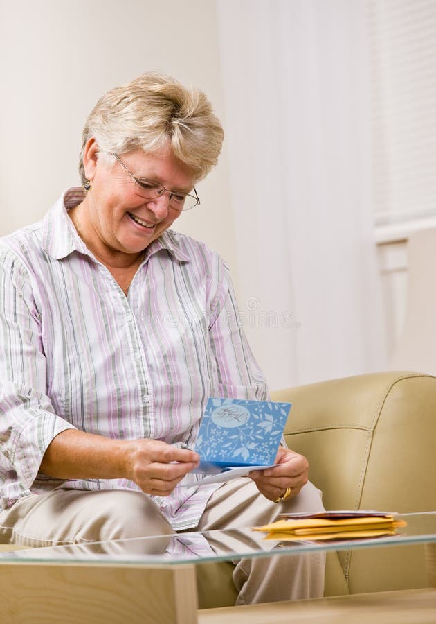 Senior Woman Reading Note Card Stock Photo - Image of retirement ...