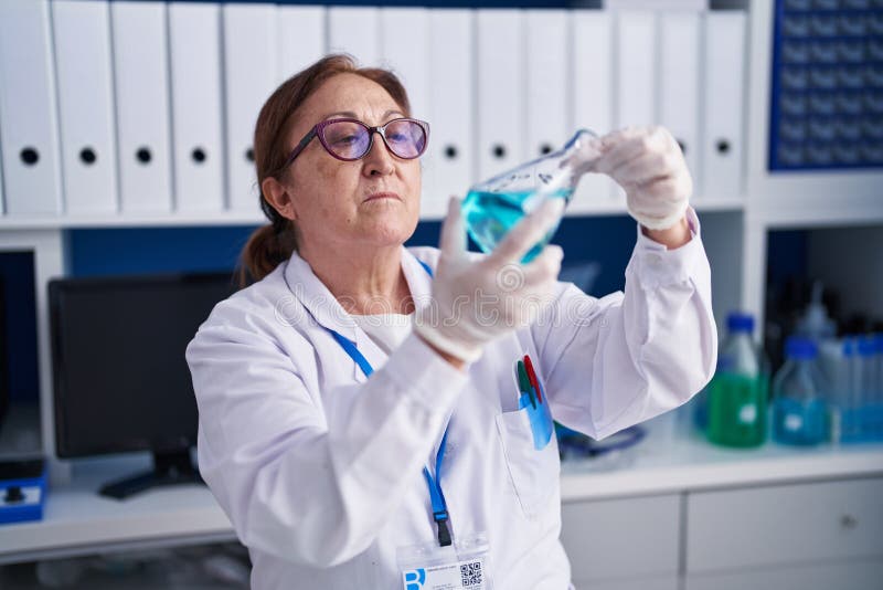 Senior Woman Scientist Measuring Liquid at Laboratory Stock Image ...