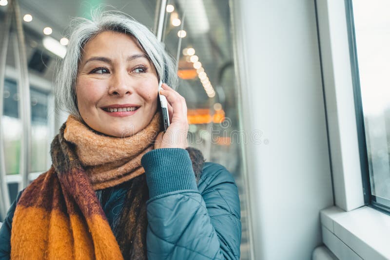 Senior Woman Send Message with a Mobile Phone in a Train Stock Image ...
