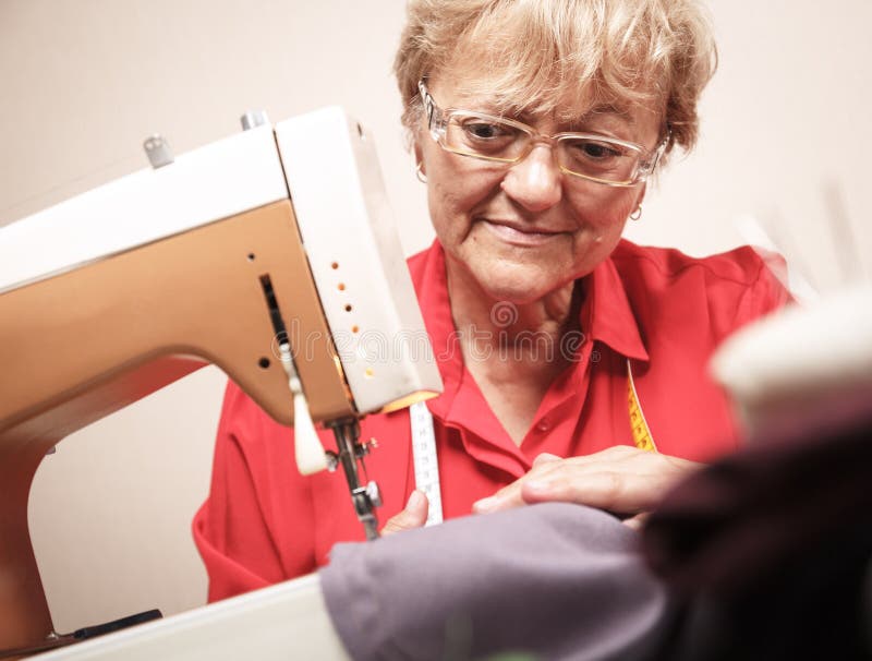 Senior Woman Sewing on a Sewing Machine Stock Photo - Image of adult ...