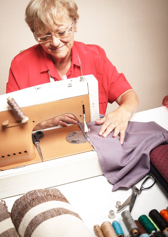Senior Woman Sewing on a Sewing Machine Stock Photo - Image of business ...