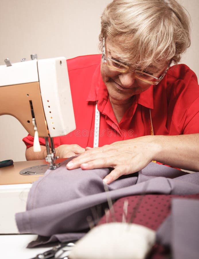 Senior Woman Sewing on a Sewing Machine Stock Image - Image of ...