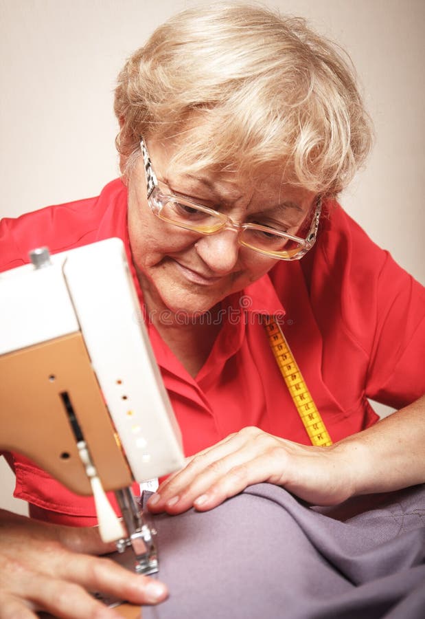 Senior Woman Sewing on a Sewing Machine Stock Photo - Image of human ...