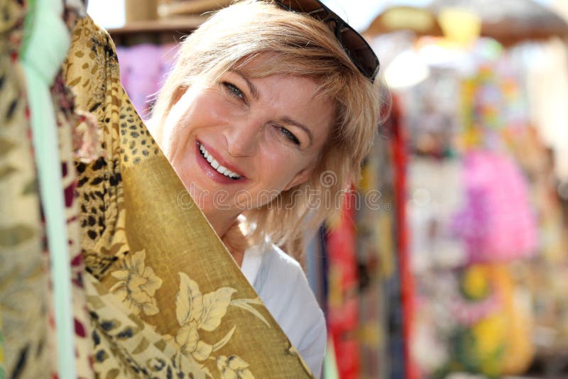 Senior woman in a shop stock photo. Image of material - 24231262