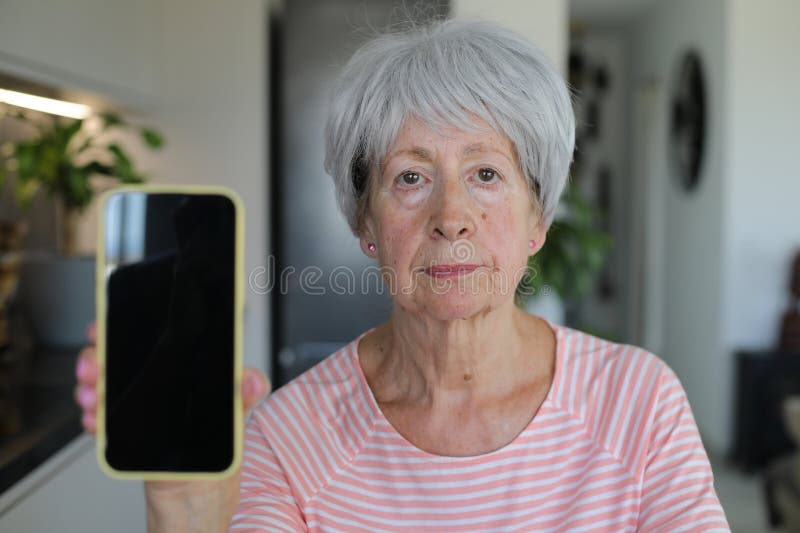 Senior Woman Showing Her Cellphone Screen Stock Photo - Image of hands ...