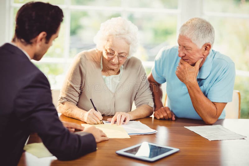 Senior Woman Signing Document Stock Photo - Image of happy, domicile ...