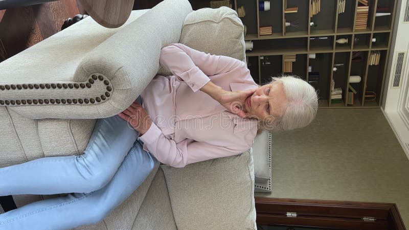 Sad Yearning Mature Woman Sit On Sofa Deep In Thoughts Stock Video