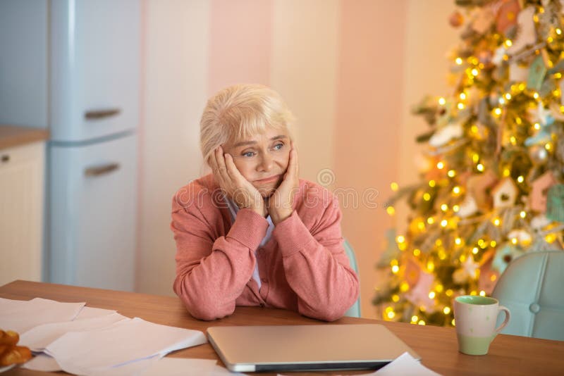Senior Woman Sitting at the Table and Thinking Stock Image - Image of ...