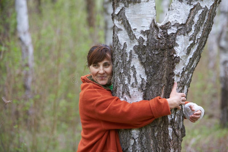 Senior Woman Smiling and Hugging a Birch Tree. Stock Image - Image of ...