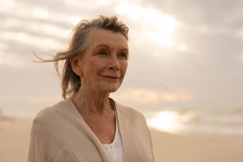 Senior Woman Standing on the Beach Stock Image - Image of process ...