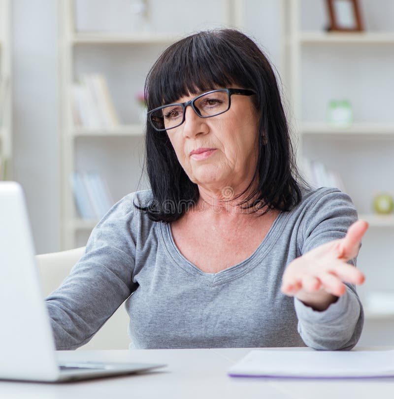 Senior Woman Struggling at Computer Stock Photo - Image of company ...
