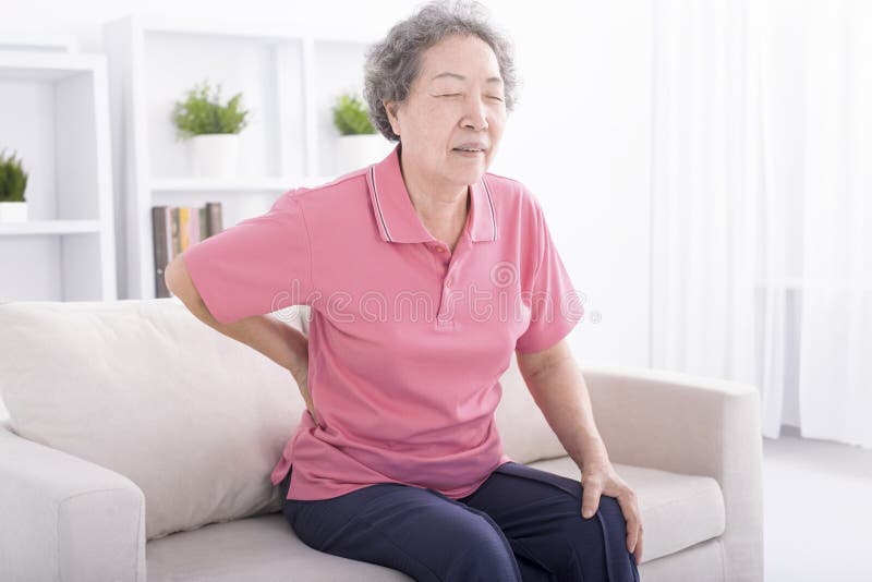 Senior Woman Suffering from Back Pain at Home Stock Photo - Image of ...