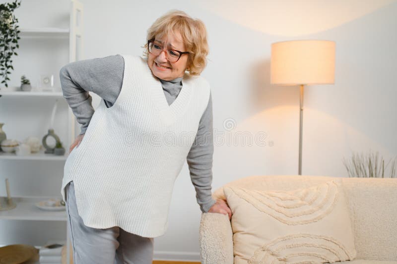 Senior Woman Suffering from Back Pain at Home Stock Photo - Image of ...