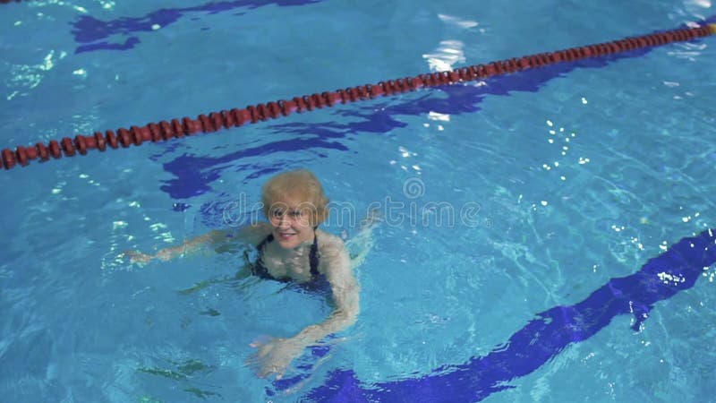 Pretty Granny Shows Thumb Up Swimming In The Pool Stock Footage Video