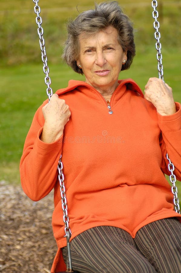 Senior woman on a swinger stock photo. Image of dynamic - 9995092