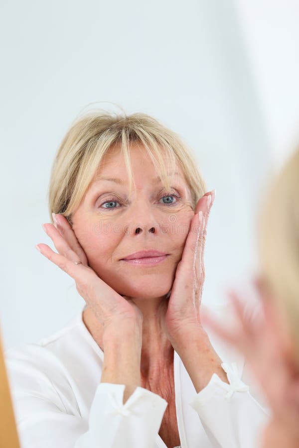 Senior Woman Taking Care of Her Face Skin Stock Image - Image of face ... Senior Woman Taking Care of Her Face Skin Stock Image - Image of face ...