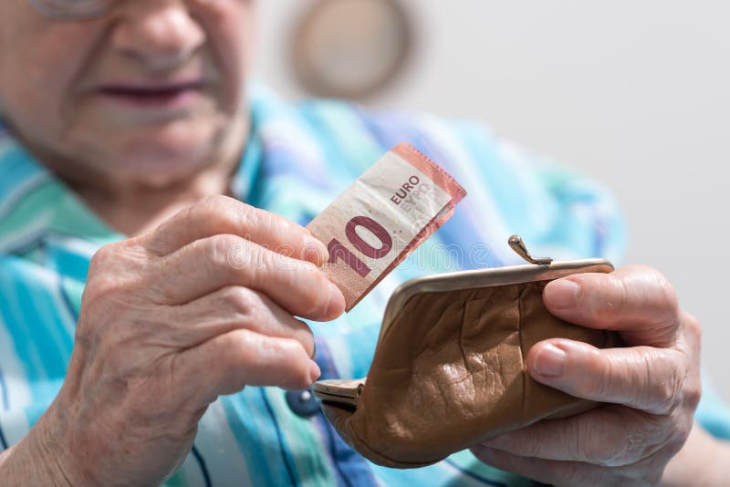 Senior Woman Taking Out a Banknote from Her Wallet Stock Photo - Image ...