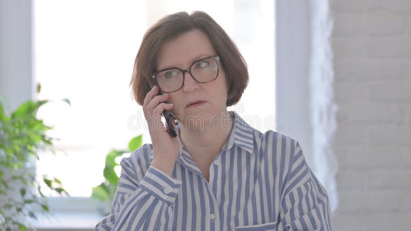 Senior Woman Talking on Phone, Discussing Work Stock Image - Image of ...