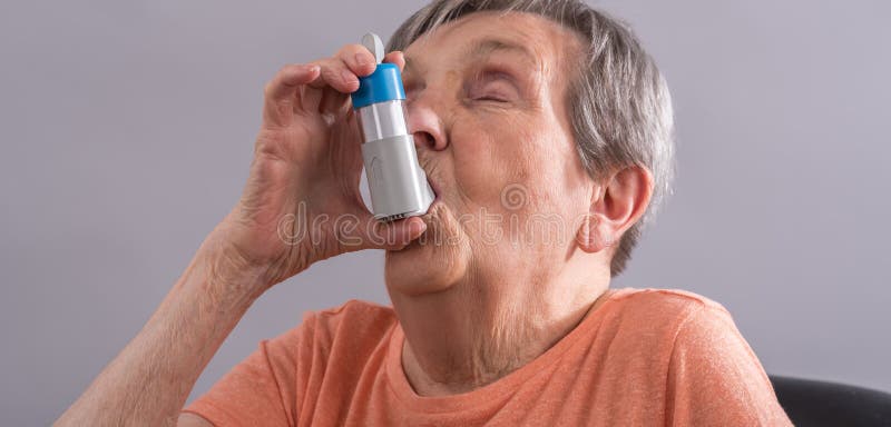 Senior Woman Using an Inhaler Stock Photo - Image of asthma, inhaling ...