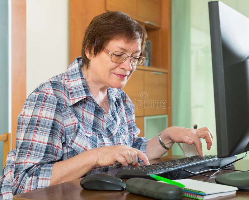 Senior Woman Using Keyboard Stock Photo - Image of interior, american ...