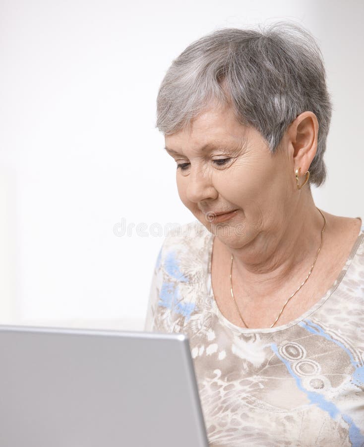 Senior Woman Using Laptop Computer Stock Photo - Image of elderly ...