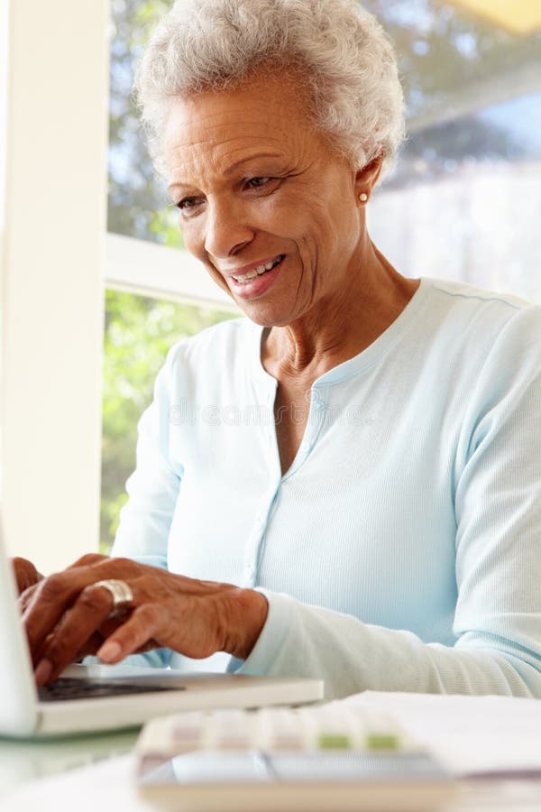 Senior Woman Using Laptop at Home Stock Image - Image of person ...
