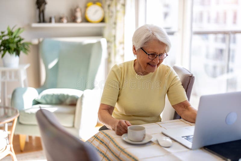 Senior Woman Using Laptop at Home Stock Image - Image of healthy ...