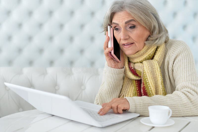 Senior woman using laptop stock photo. Image of portrait - 85541834