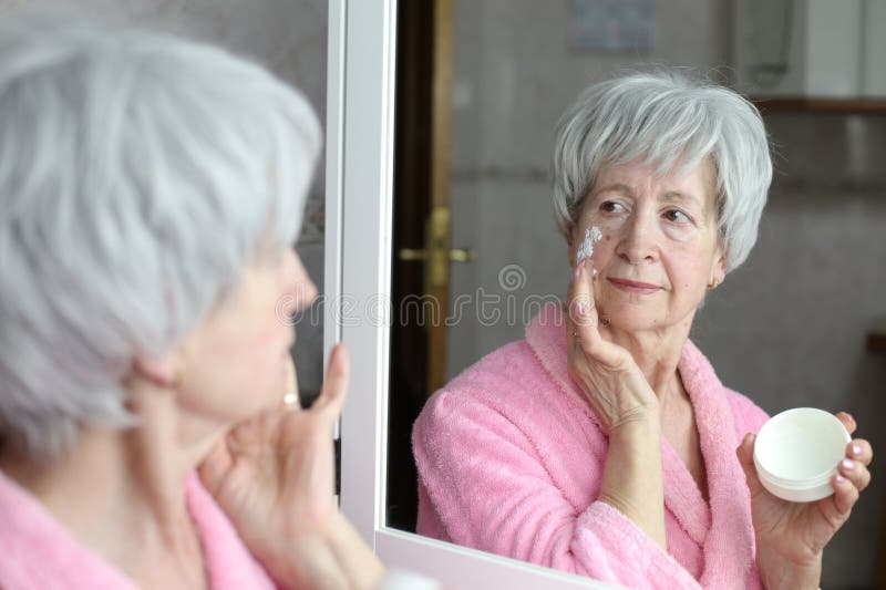 Senior Woman Using Moisturizing Cream Stock Image - Image of caucasian ...