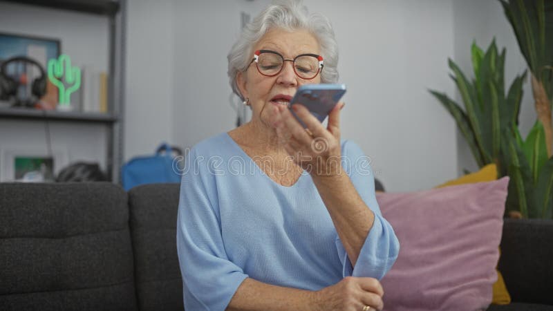 Senior Woman Using Smartphone in Modern Living Room Stock Image - Image ...