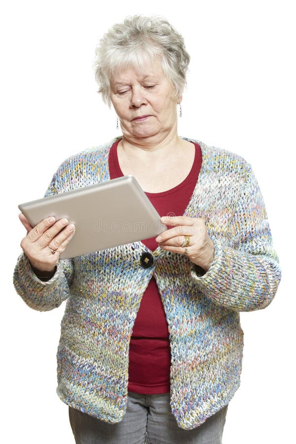 Senior Woman Using Tablet Computer Looking Confused Stock Photo - Image ... Senior Woman Using Tablet Computer Looking Confused Stock Photo - Image ...