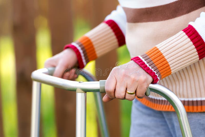 Senior Woman Using a Walker Stock Photo - Image of nature, injury: 56885610
