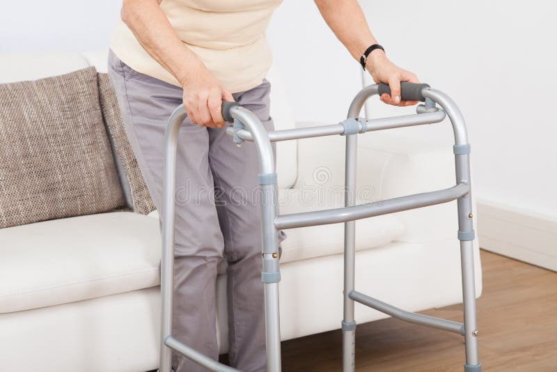 Senior Woman Using Walking Frame Stock Image - Image of indoors ...