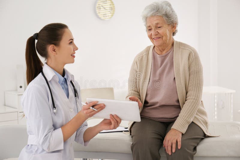 Senior Woman Visiting Doctor in Office Stock Photo - Image of ...