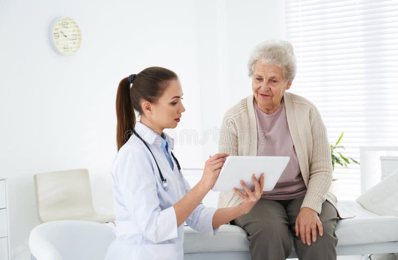 Senior Woman Visiting Doctor in Office Stock Image - Image of clinic ...