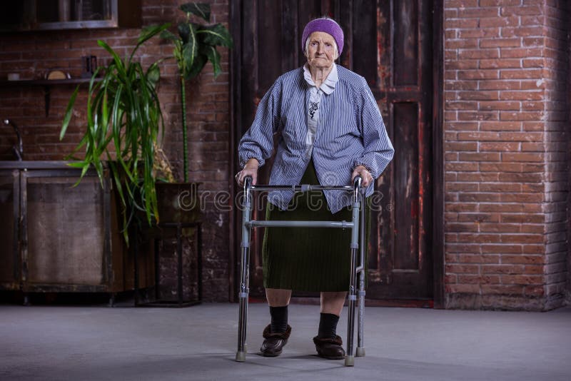 Old Woman with Walker stock photo. Image of dangerous - 2132648