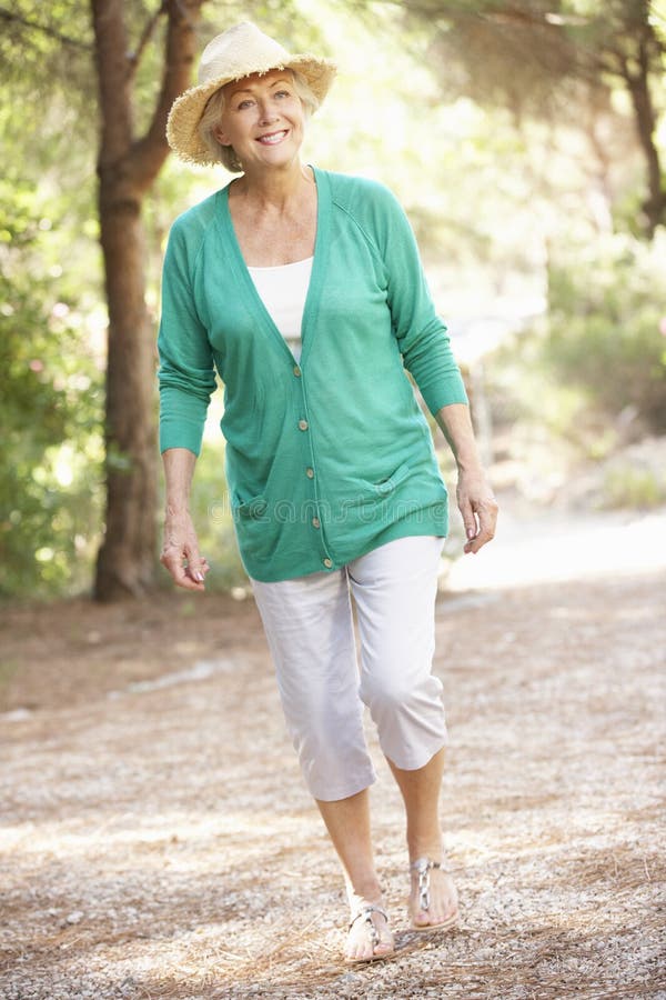 Senior Woman Walking in Countryside Stock Photo - Image of woman, walk ...