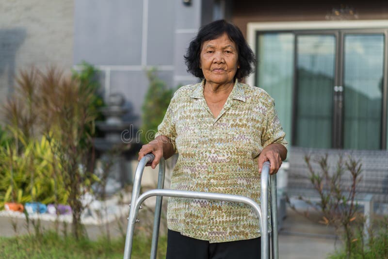Senior Woman Walking with Walker Stock Photo - Image of portrait ...
