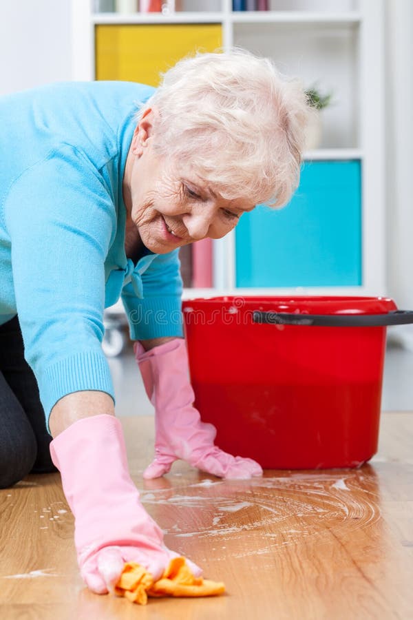 Senior woman washing floor stock image. Image of housework - 38384109