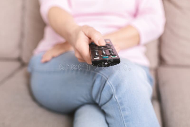 Senior Woman Changing Channels on Tv with Remote Control Stock Image ... Senior Woman Changing Channels on Tv with Remote Control Stock Image ...