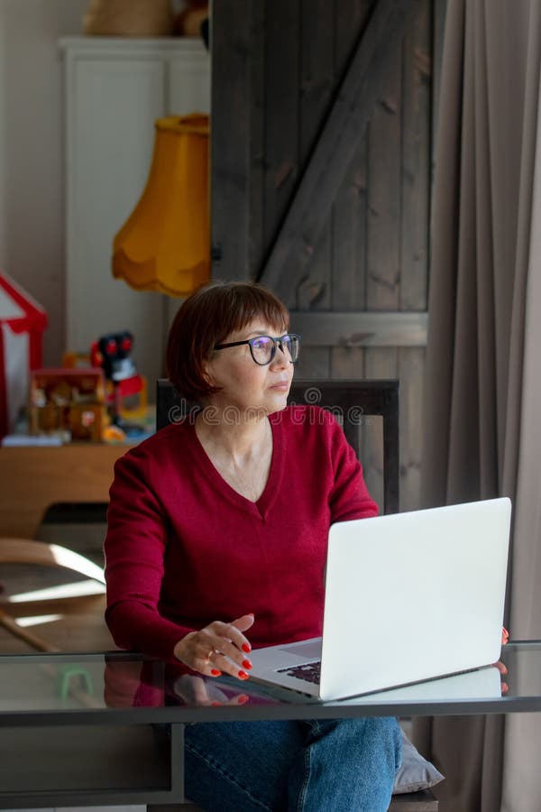 Senior Woman Working with Laptop Computer at Home Stock Photo - Image ...