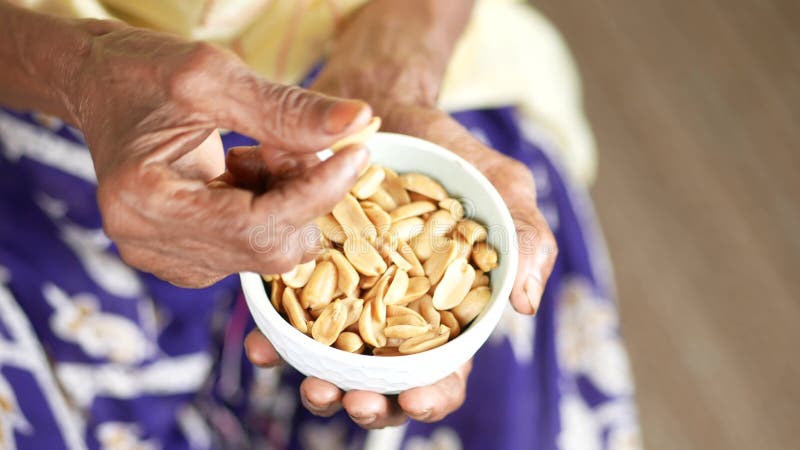 Senior Women Hand Pick Peanuts Form a Bowl Stock Video - Video of bowl ...