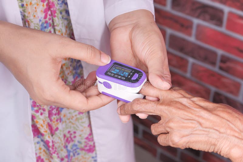 Senior Women Hand Using Pulse Oximeter Stock Photo - Image of monitor ...