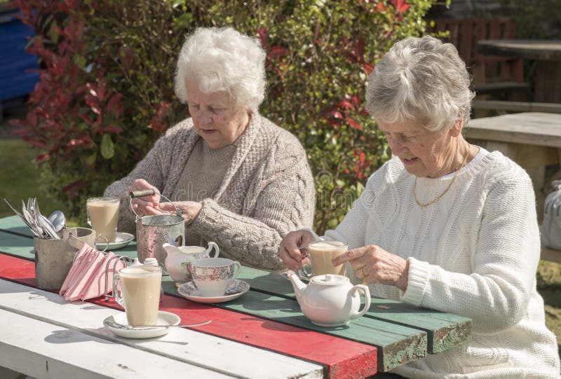Senior Women Having Coffee Outdoors Stock Photo - Image of seniors ...