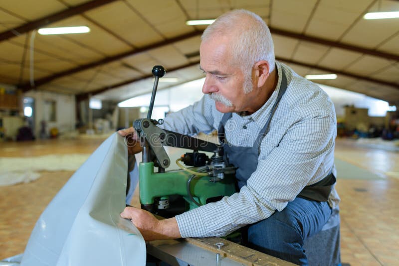 Senior Worker in Factory on Machine Stock Photo - Image of machine ...