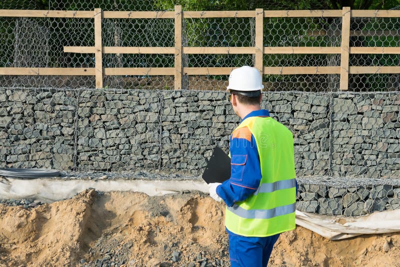 A Senior Worker Performs the Correct Work To Strengthen the Coast Stock ...