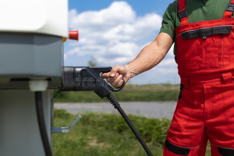 Senior Worker Standing on Gas Station and Fueling Car. Stock Photo ...