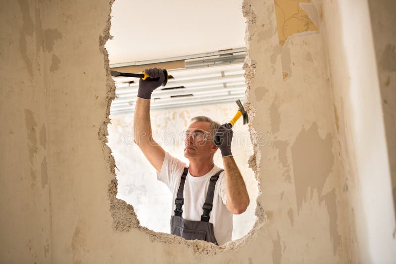 Senior Worker Using Tool at Contruction Site Stock Image - Image of ...