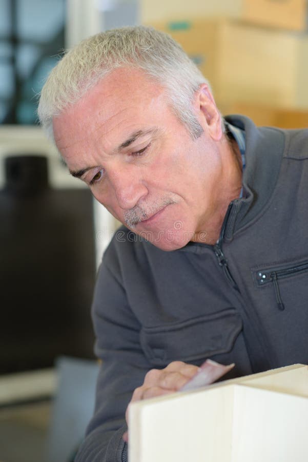 Senior worker in workshop stock image. Image of profession - 232648041